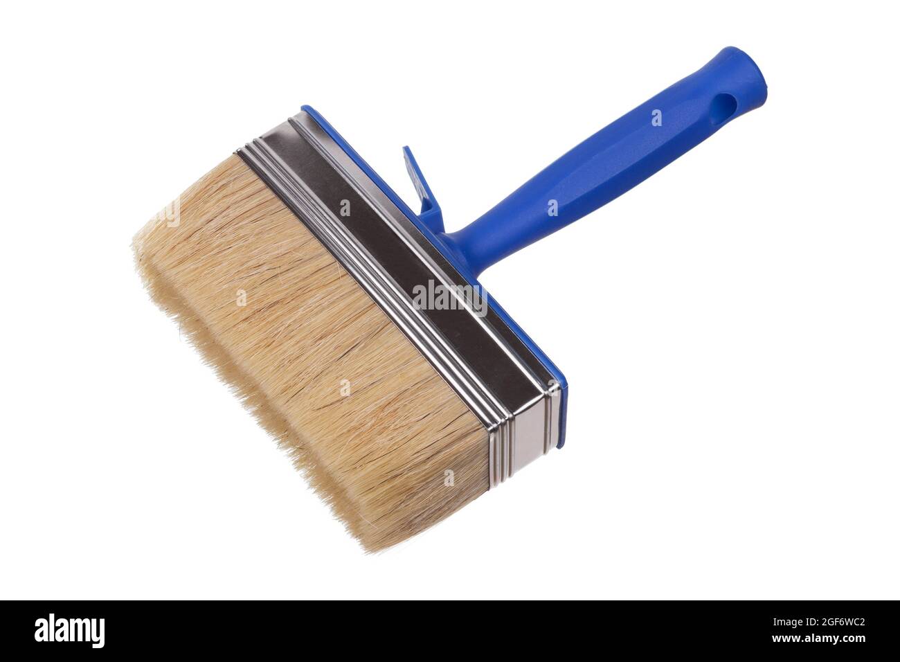 Closeup of paintbrush with natural bristle and blue plastic handle for ...