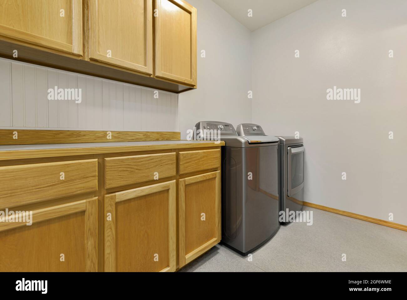 Modern residential laundry room interior Stock Photo - Alamy