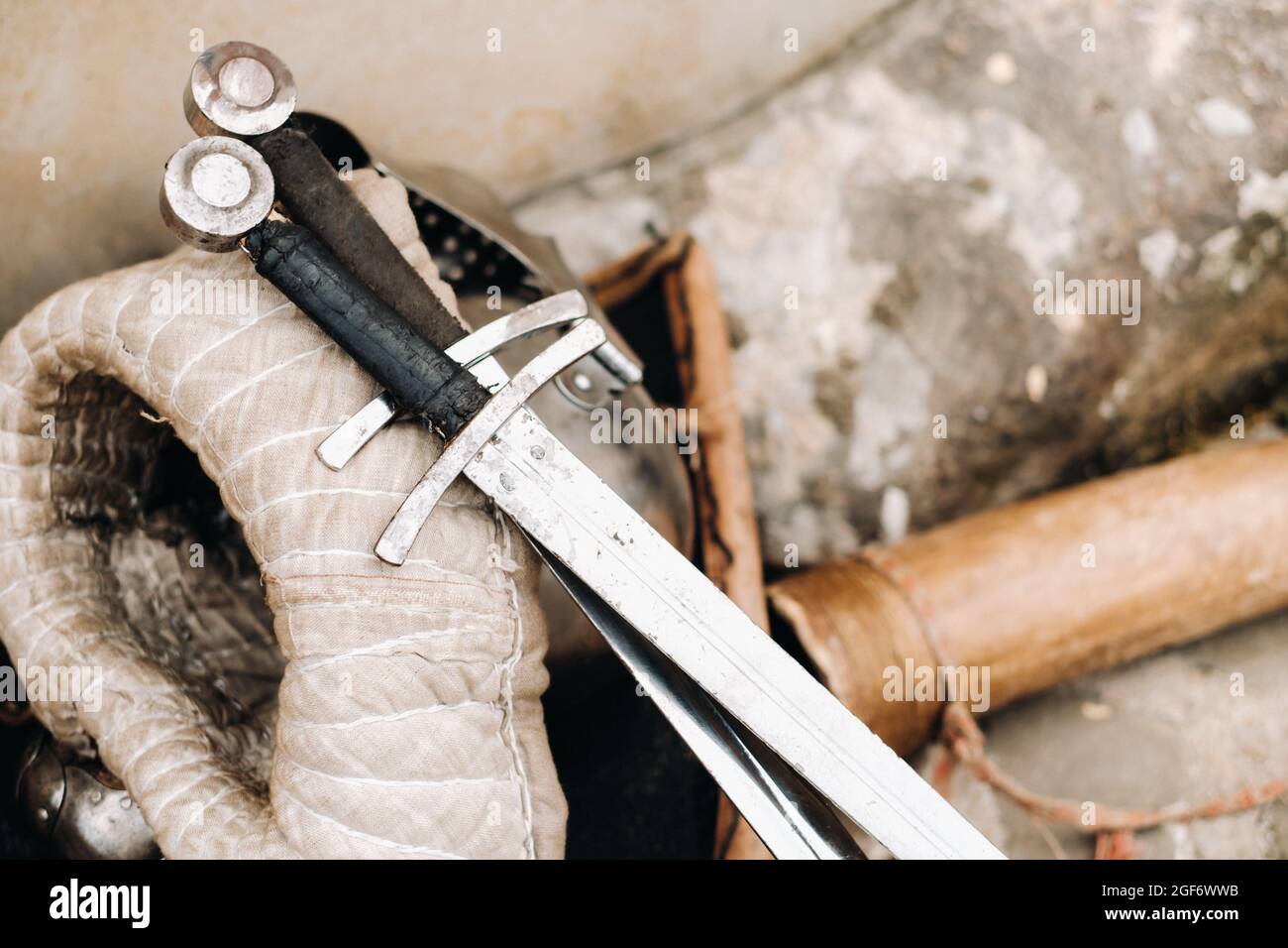 Beautiful swords lying on the knight's equipment, performance in the ...