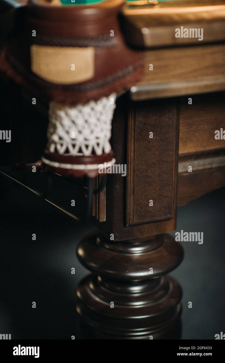 Leather billiard hole and table leg in a billiard club Stock Photo - Alamy