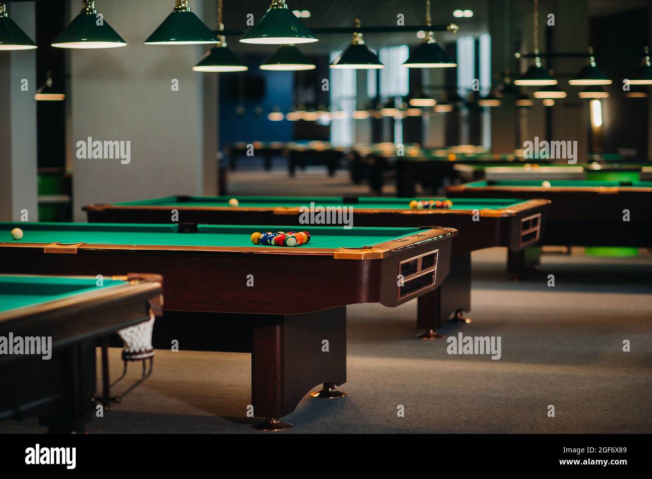 Billiard table with green surface and balls in the billiard club.Pool ...