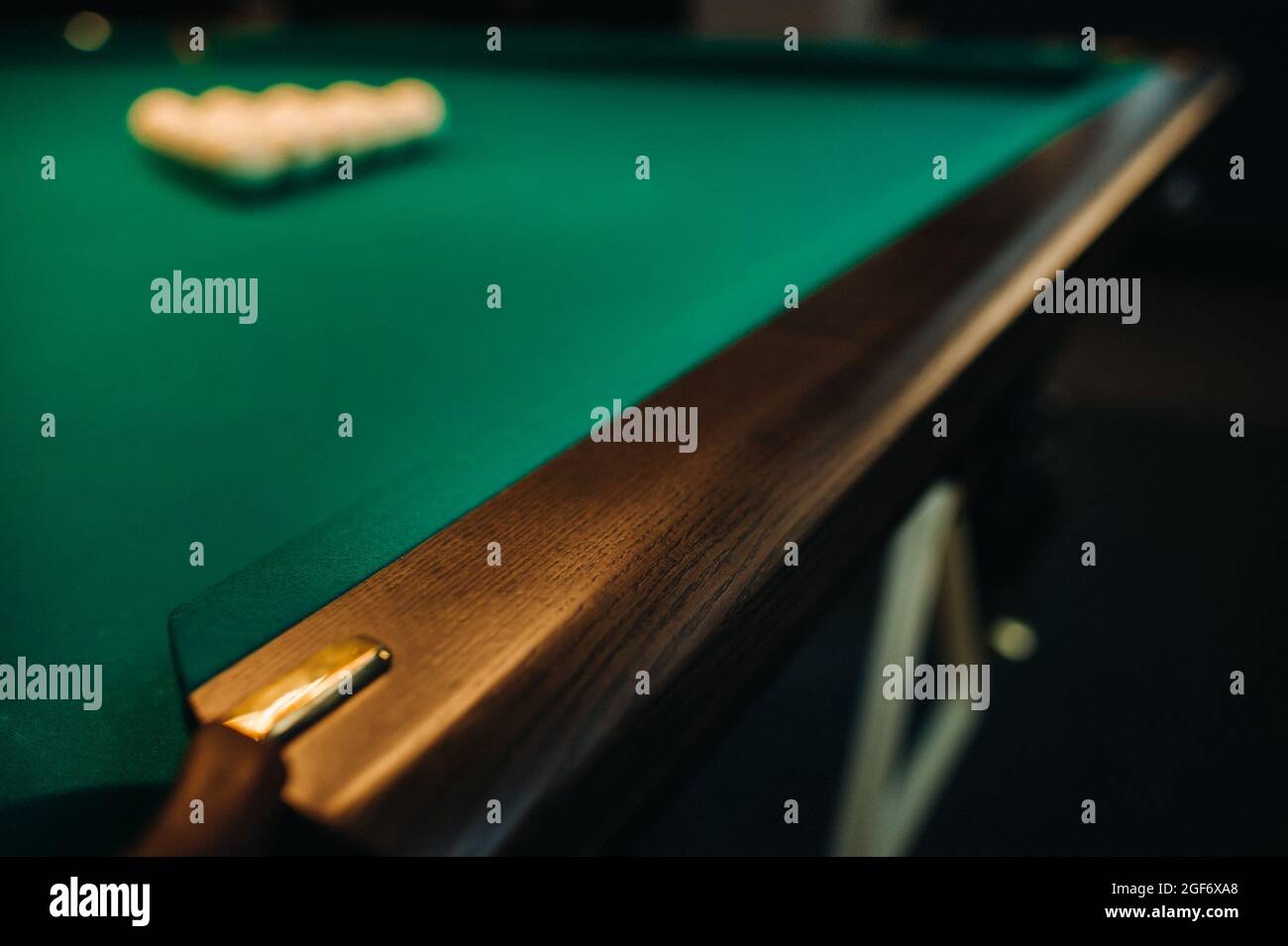 The oak decorative leg of a billiard table looks expensive Stock Photo ...