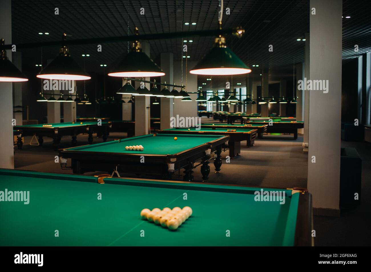 Billiard table with green surface and balls in the billiard club Stock ...