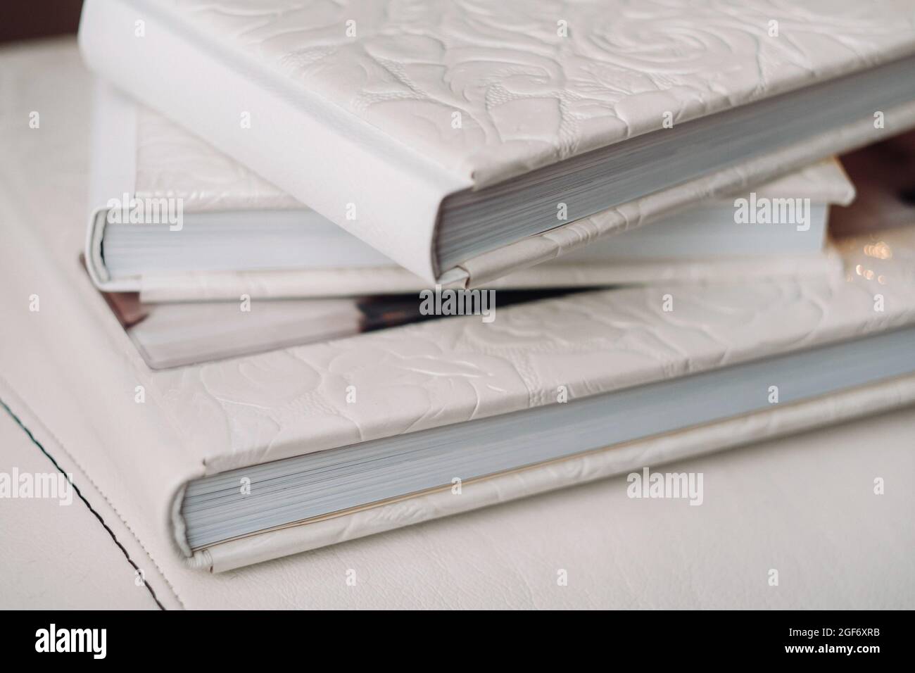 Composition of photobooks in natural brown leather . Fragment of a ...