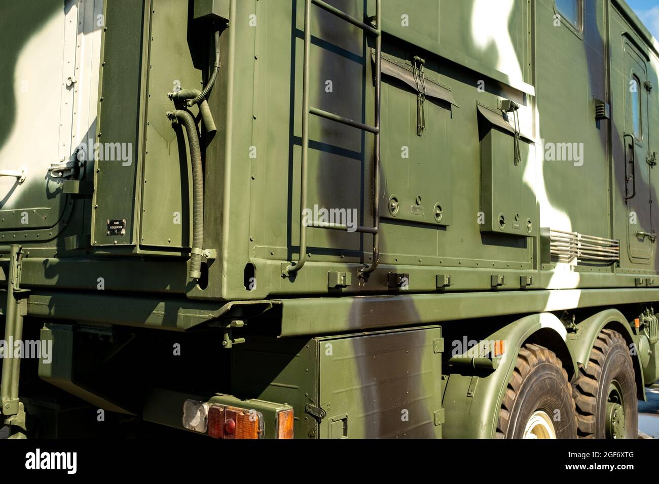 A close-up of the body of a military car on the side is green. Military ...