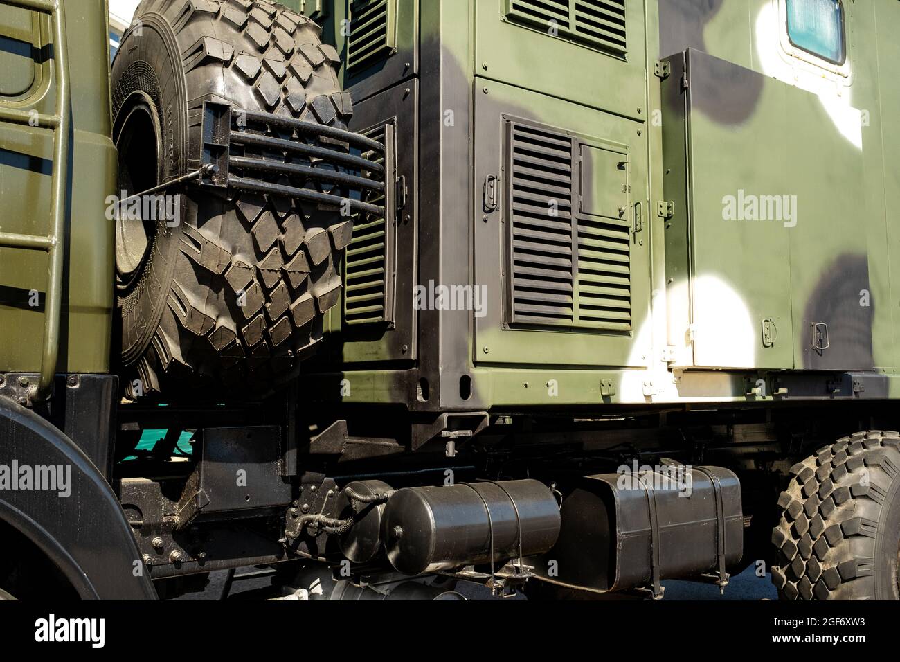 A close-up of the body of a military car on the side is green. Military ...