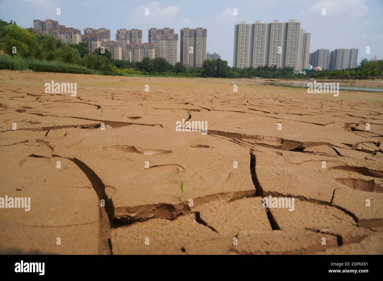 View of the riverside cracked after rainstorm and flood water receeded ...