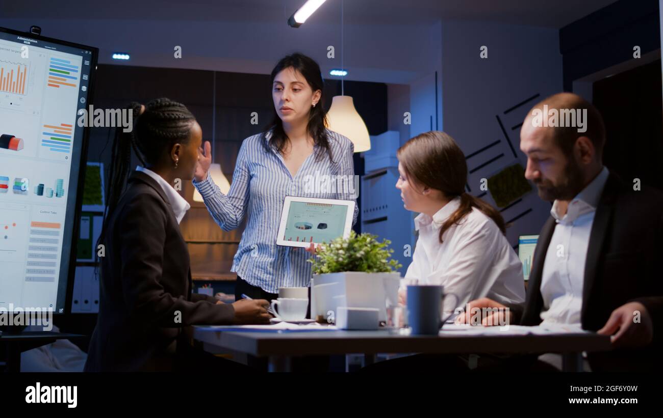 Overworked workaholic entrepreneur woman shwoing marketing graphs using ...