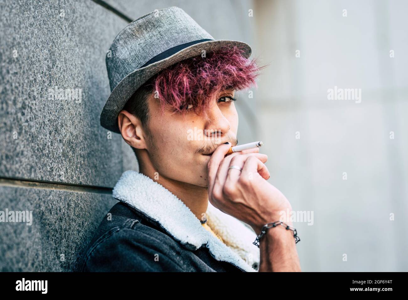 Teen boy smoking cigarette hi-res stock photography and images - Alamy