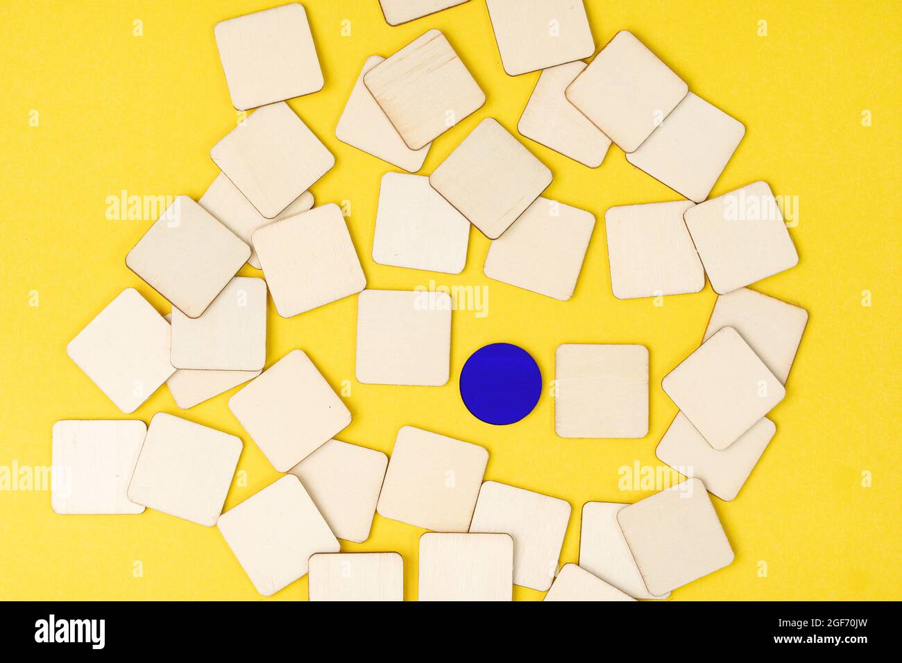 Human Resources concept. Square wooden tiles with one different shape ...