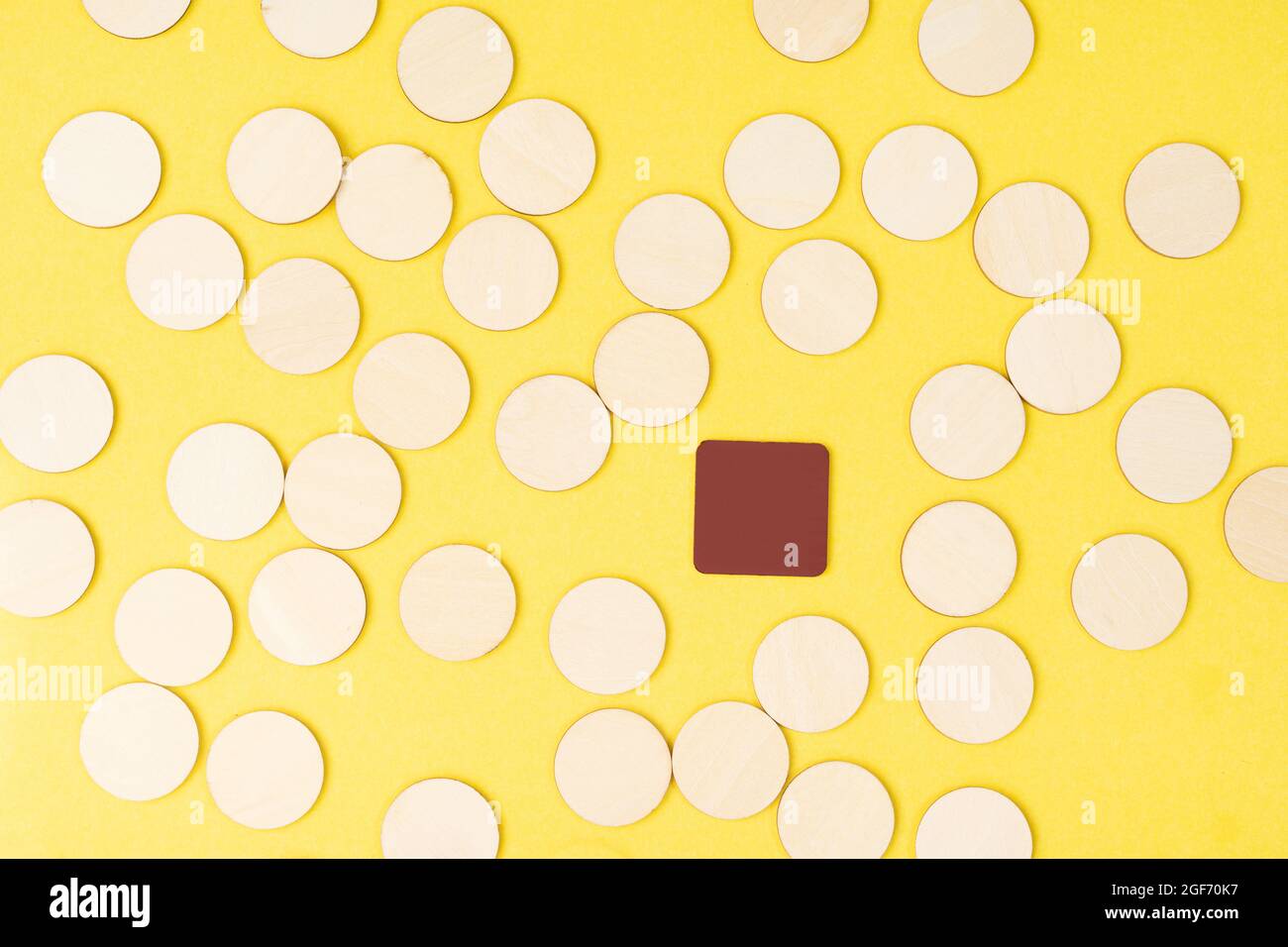 Human Resources concept. Round wooden tiles with one different shape ...