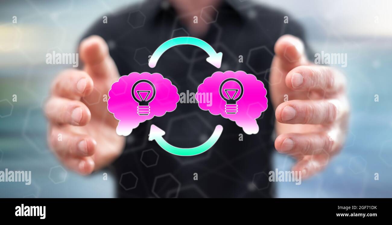 Knowledge sharing concept between hands of a man in background Stock ...