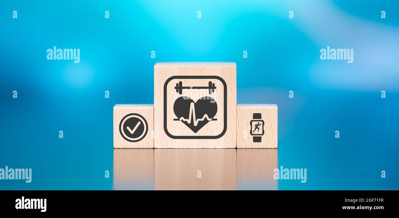 Wooden blocks with symbol of fitness concept on blue background Stock ...