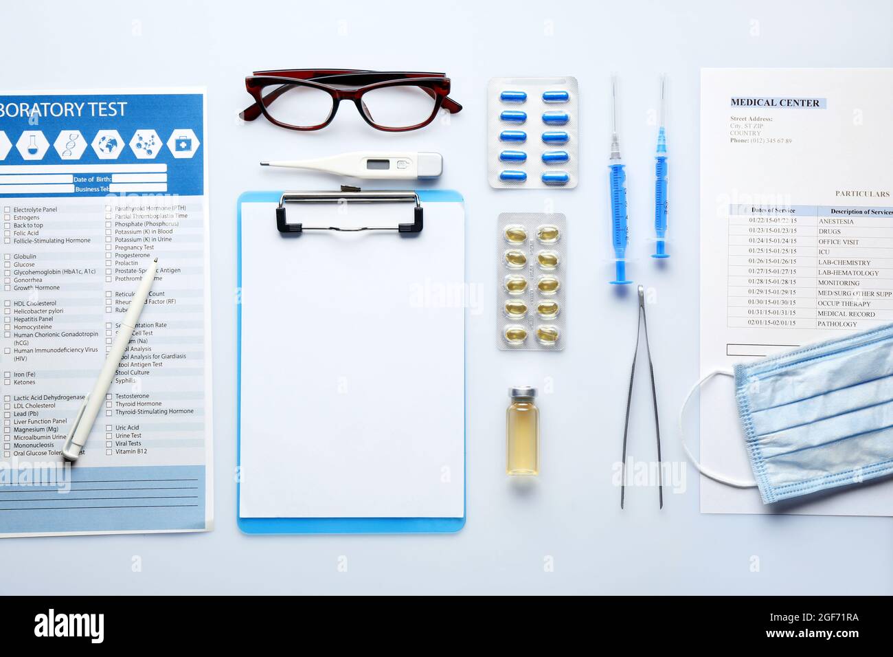 Doctor table with medicines and glasses, top view Stock Photo - Alamy