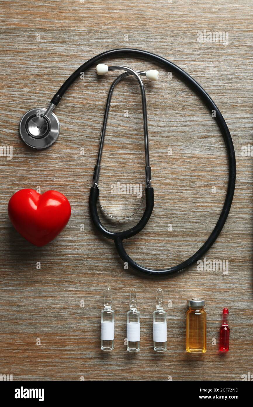 Doctor table with medicines and stethoscope, top view Stock Photo - Alamy
