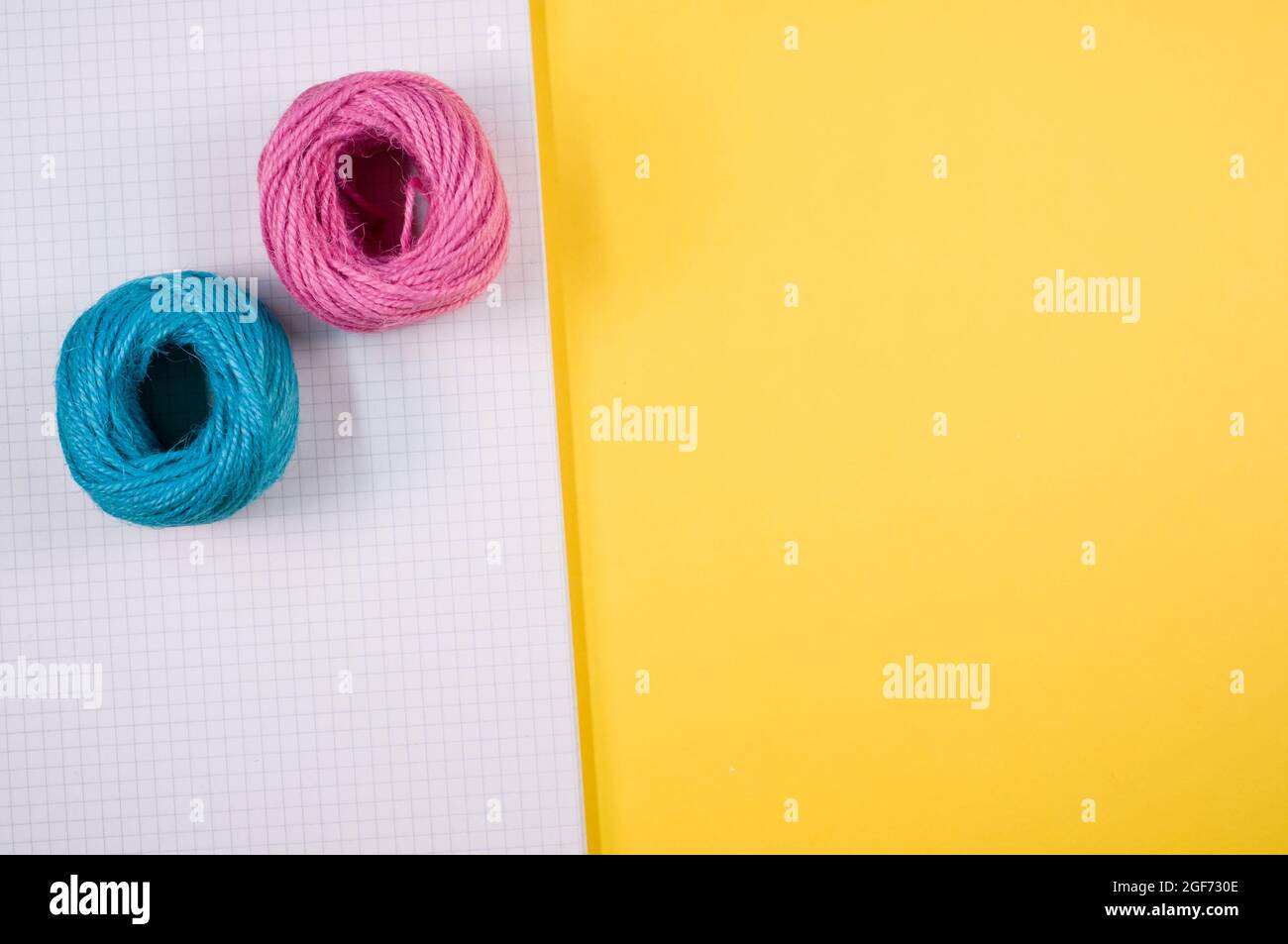 Top view of colorful thread rope yarn on a yellow and background Stock ...