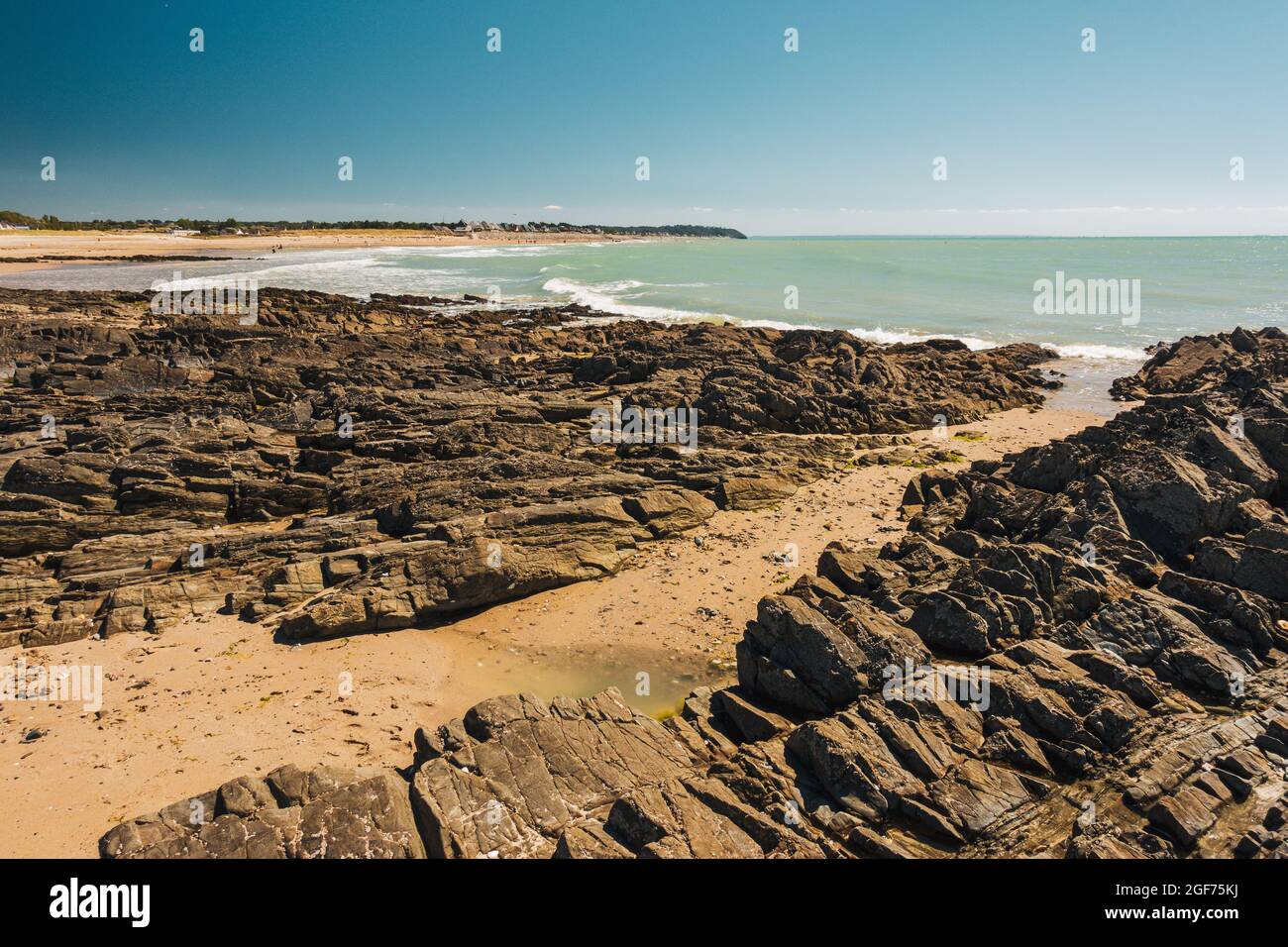 Rocky and sandy beach on a sunny day, in Normandy, France Stock Photo ...