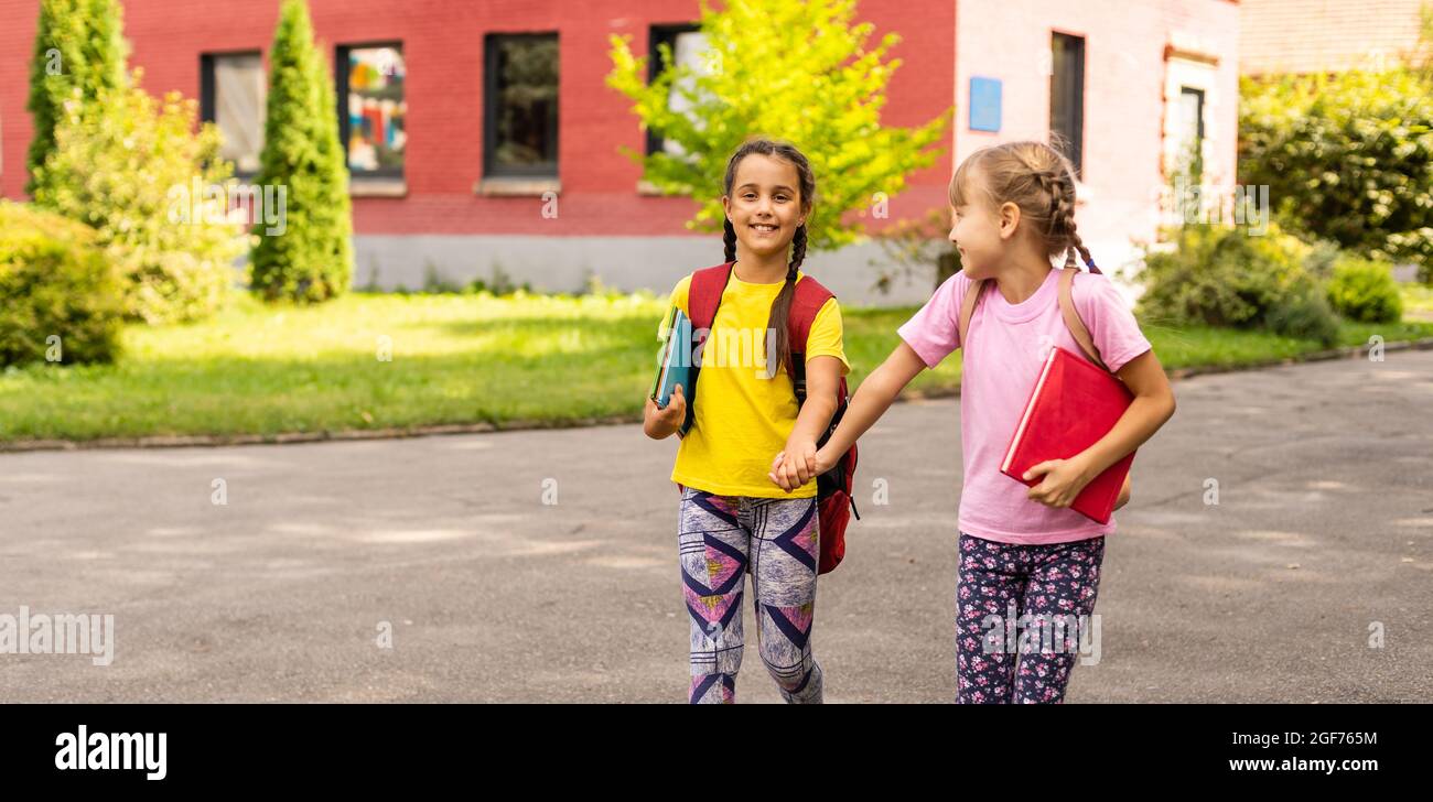 Back to school. First day of school. Two teenage girs at the school ...
