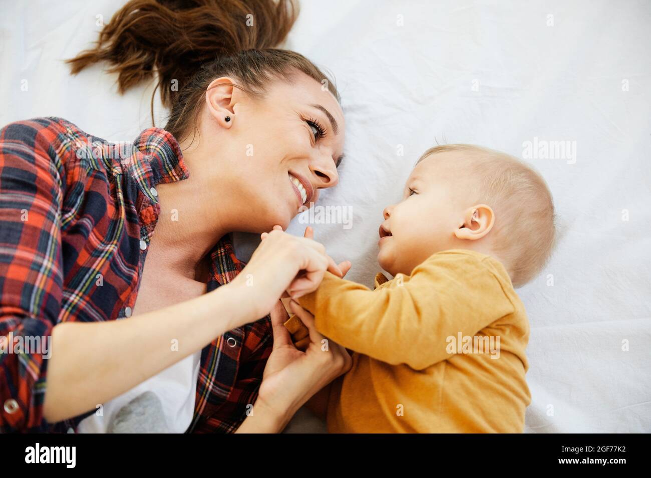 mother child baby having fun family happy childhood care cheerful cute boy sun Stock Photo - Alamy