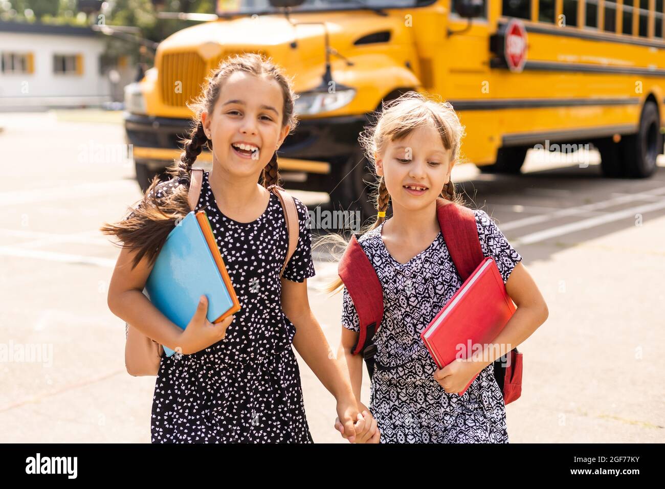 Basic school students crossing the road Stock Photo - Alamy