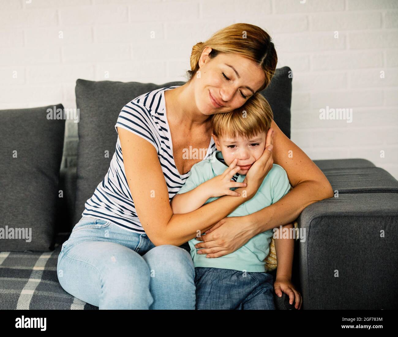 child mother boy son family woman crying parent sad love kid childhood care calming down comfort ...