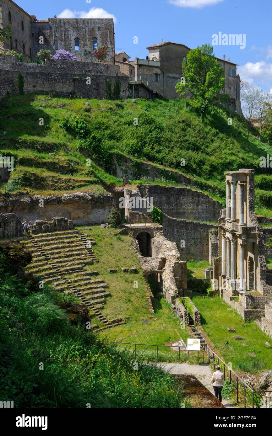 Ruin of ancient Roman theatre on steep slope, Volterra, Tuscany, Italy ...