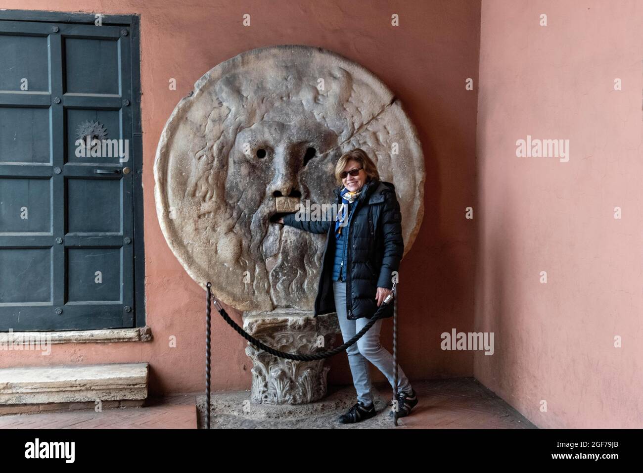 Western tourist puts hand in mouth of truth, Basilica Santa Maria di ...