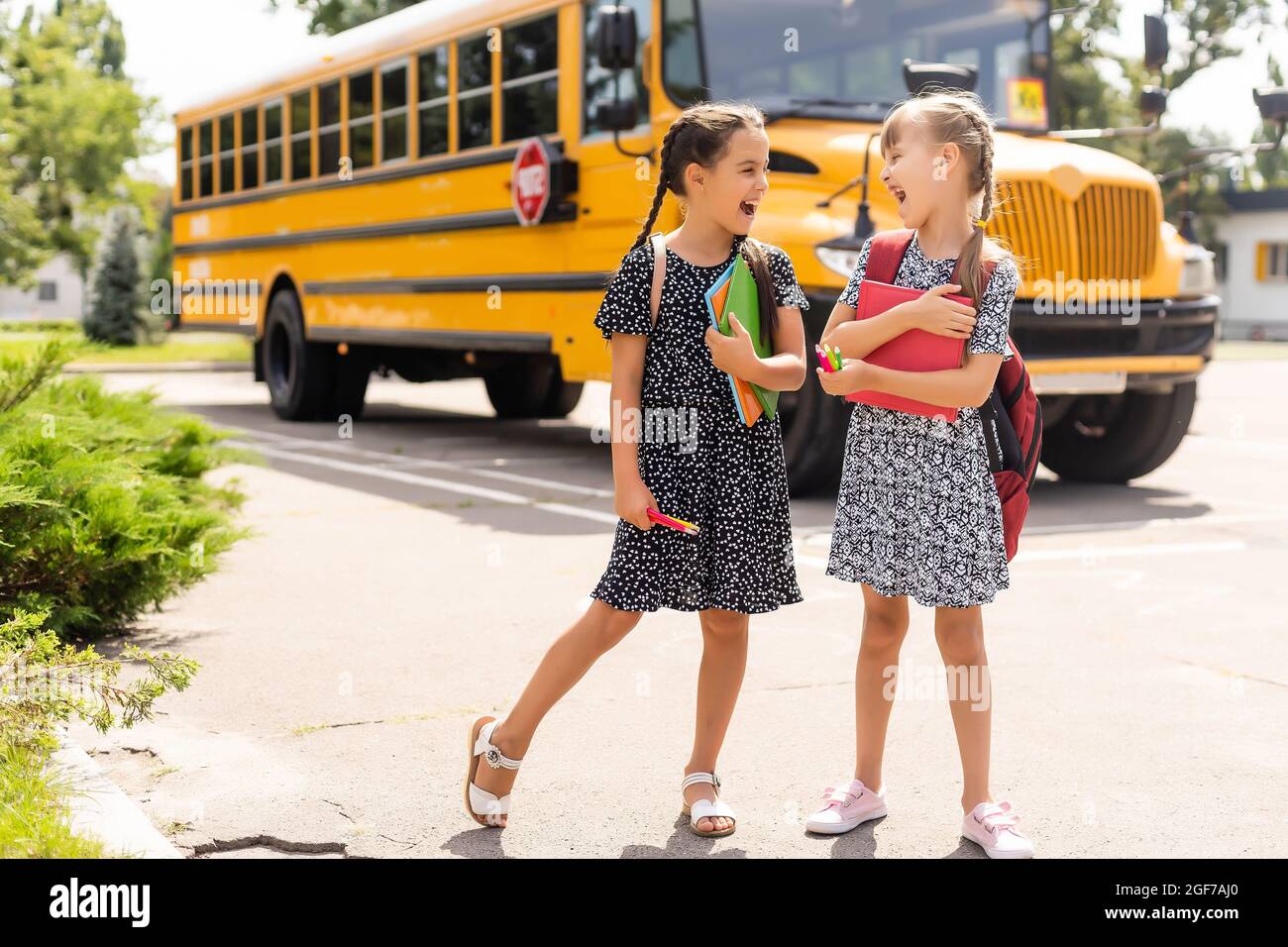 Basic school students crossing the road Stock Photo - Alamy