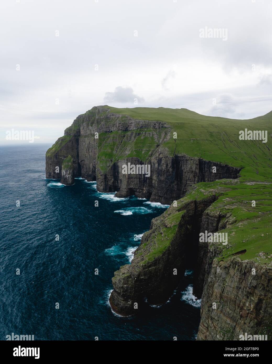 Aerial view, Asmundarstakkur cliff, Sandvik, Suduroy, Faroe Islands ...