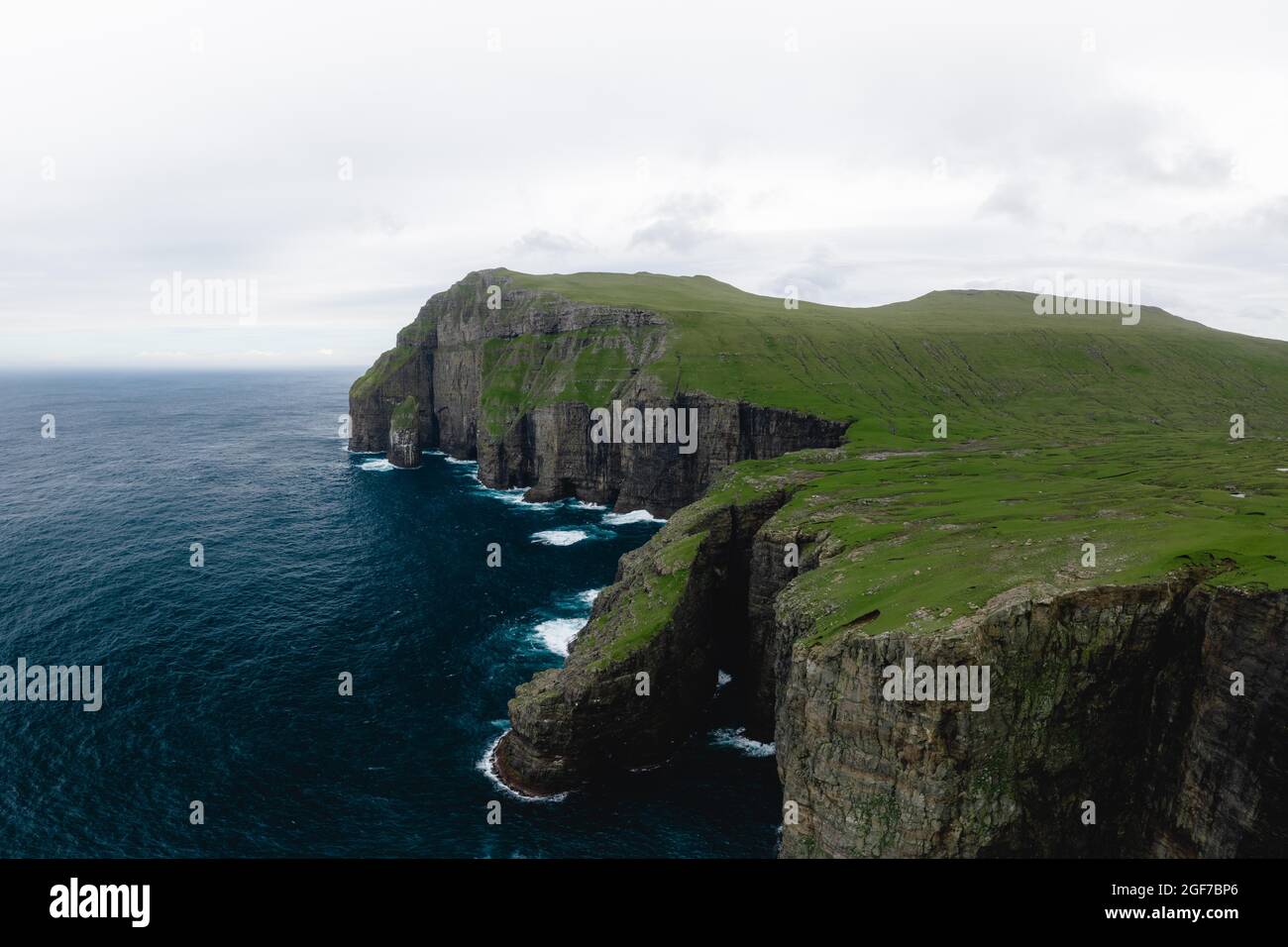 Aerial view, Asmundarstakkur cliff, Sandvik, Suduroy, Faroe Islands ...