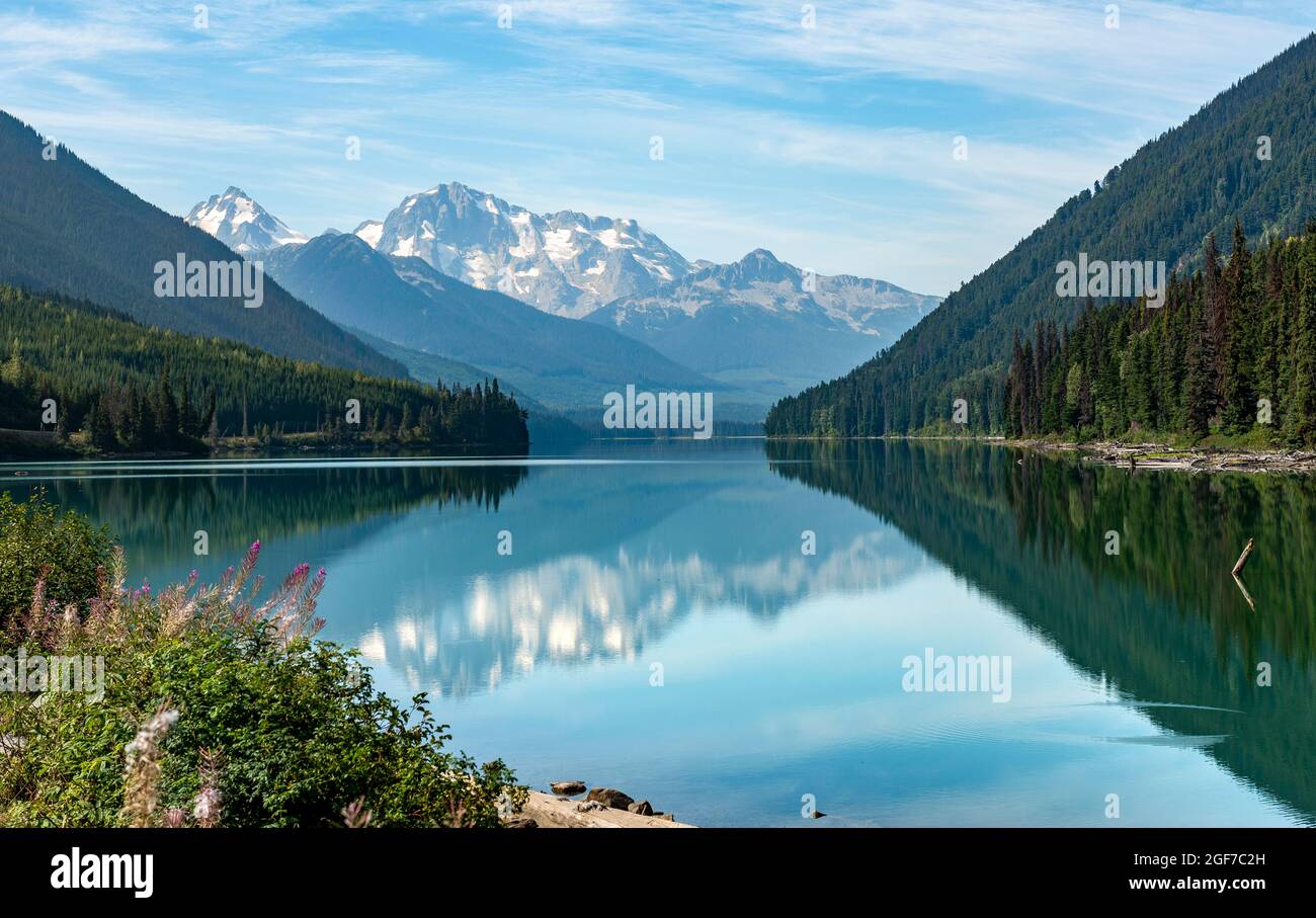 Duffey Lake, snow-capped mountains seal themselves in a lake, Joffrey ...