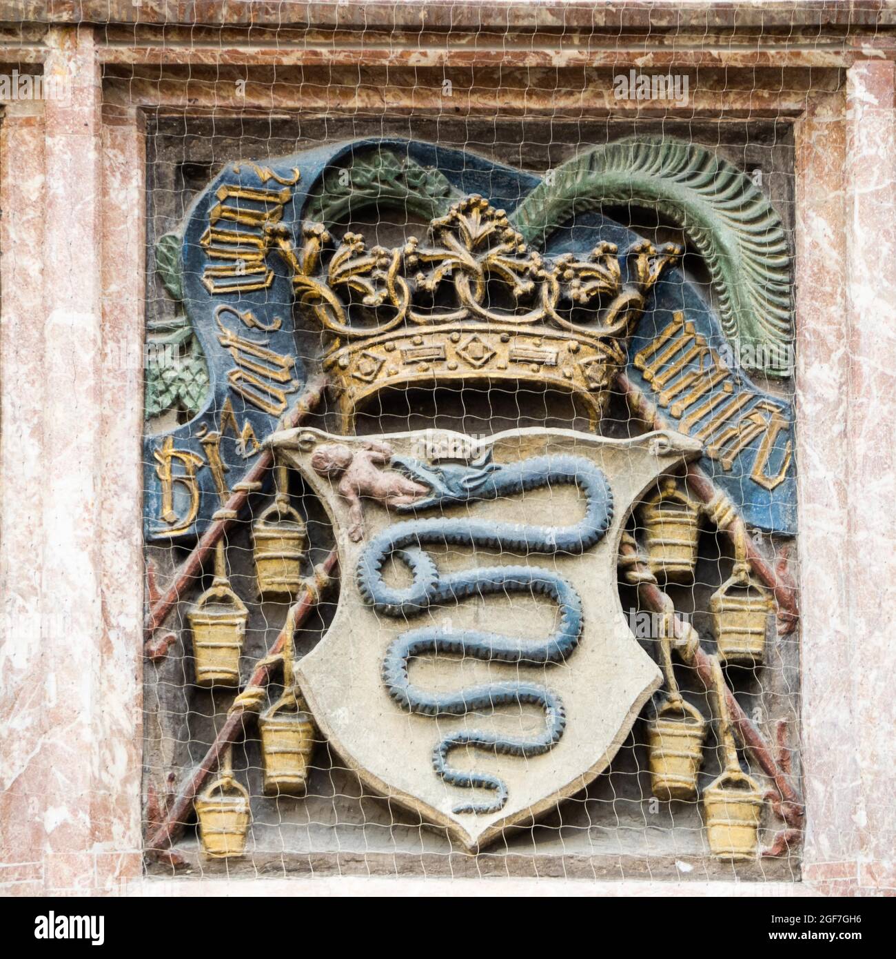 The famous golden roof building, with a close-up of the arms displayed ...