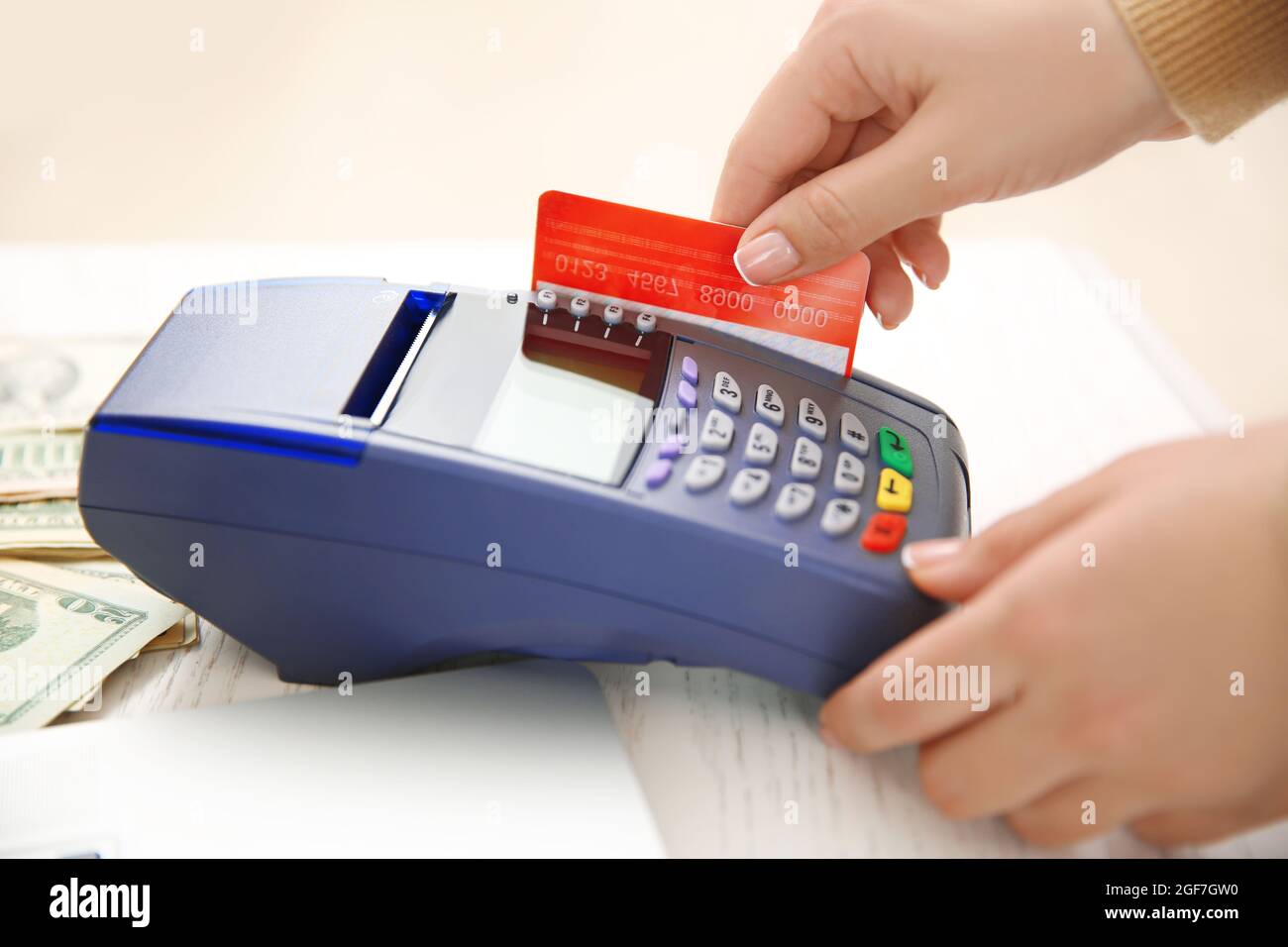 Female hand with credit card and bank terminal Stock Photo - Alamy