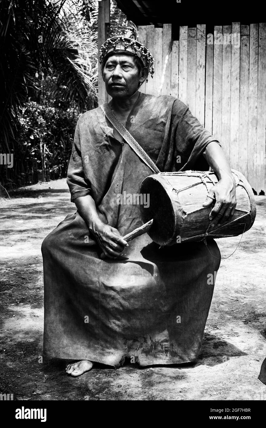 Asháninka or Asháninca man playing music and wearing traditional dress ...