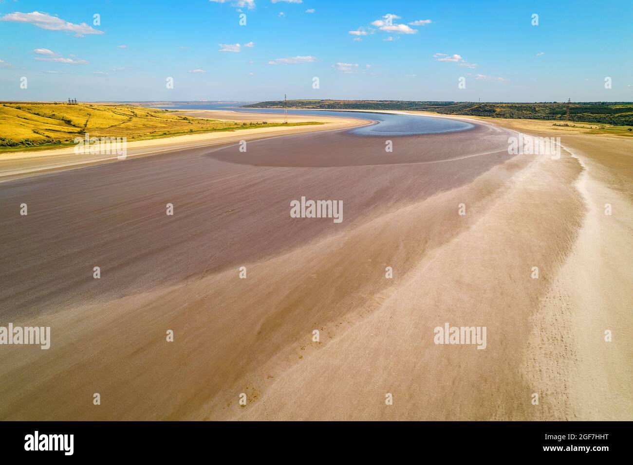 Amazing beauty of dried salty lake of light beige color surrounded by ...