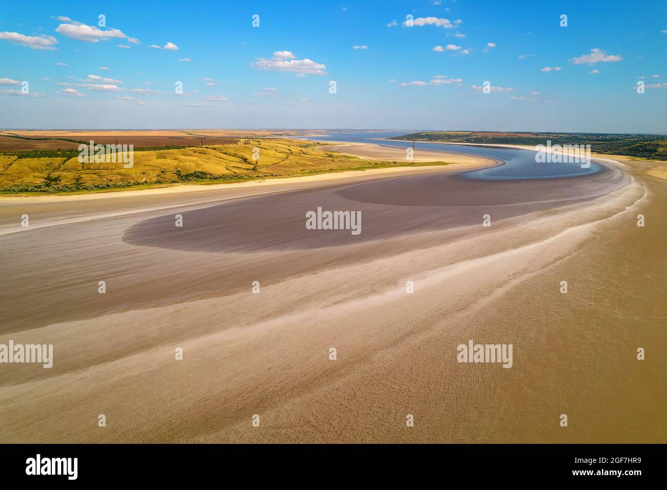 Amazing beauty of dried salty lake of light beige color surrounded by ...