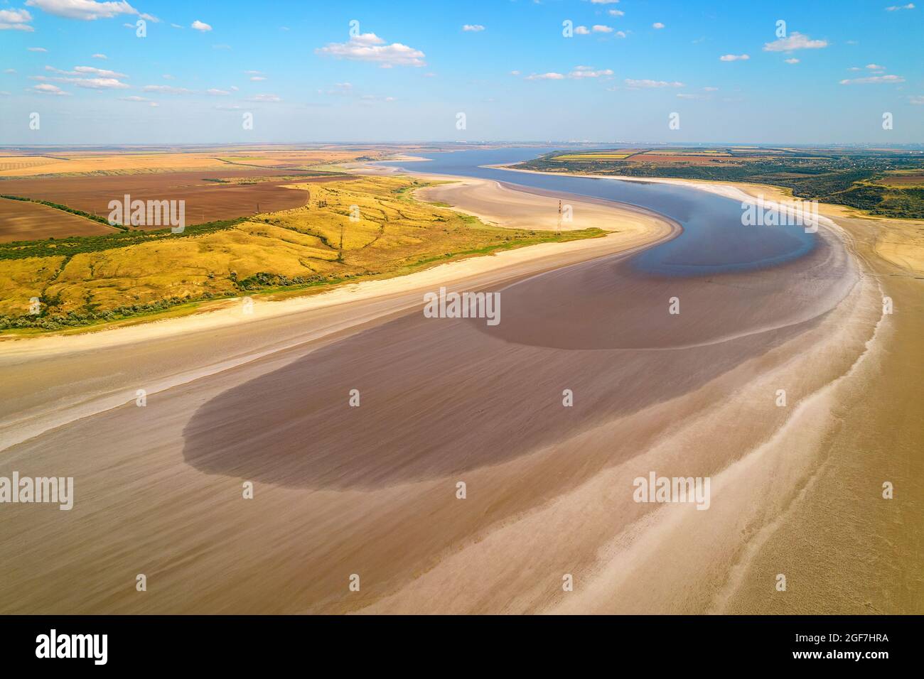 Amazing beauty of dried salty lake of light beige color surrounded by ...