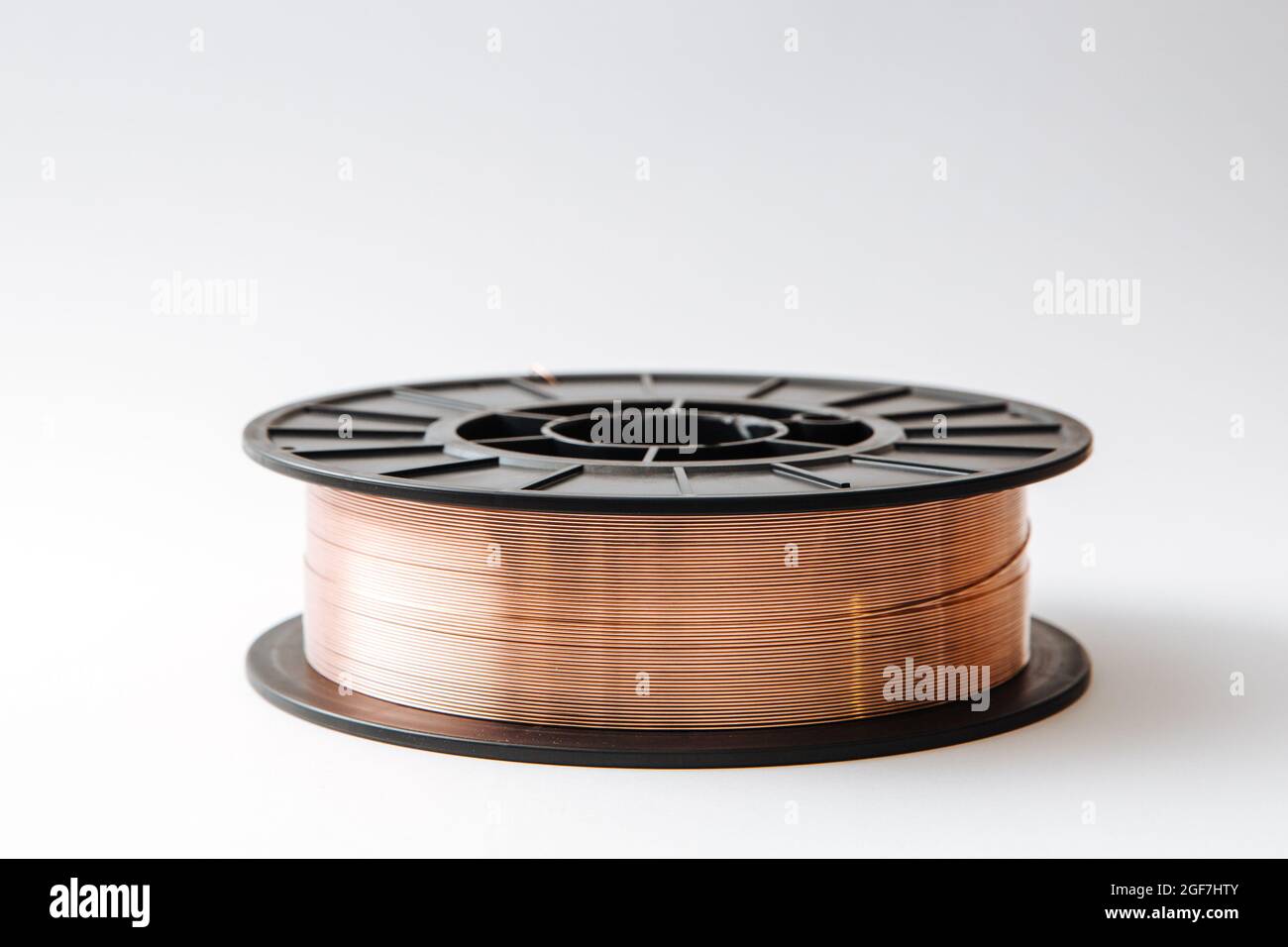 Welding wire spool on a white background Stock Photo - Alamy