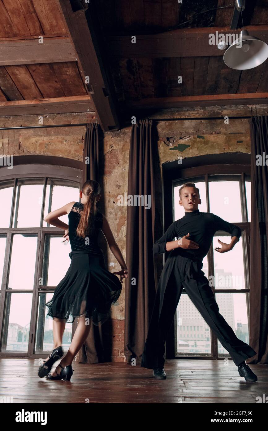 Young couple boy and girl dancing in ballroom dance Rumba Stock Photo ...