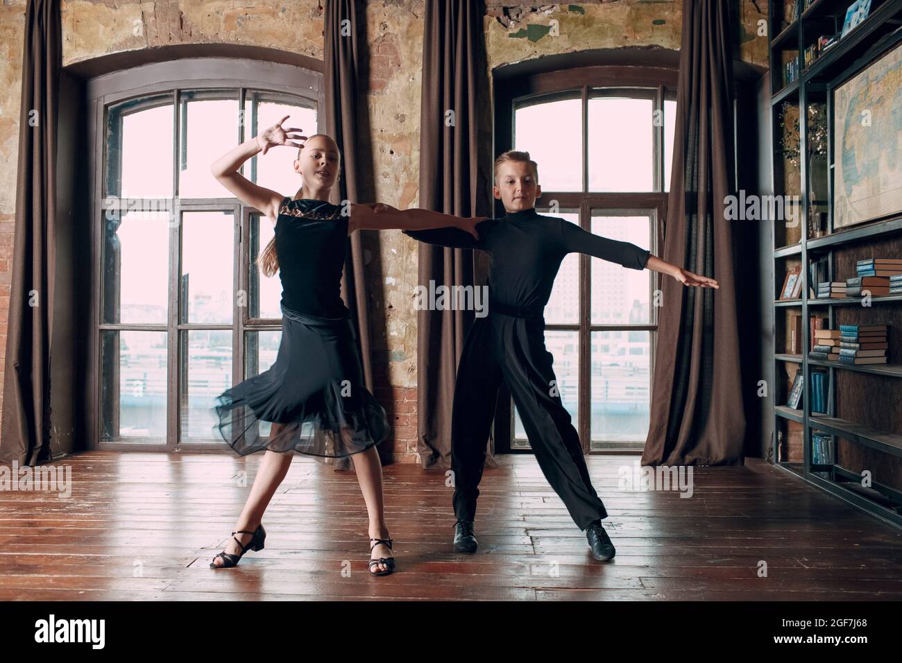 Young couple boy and girl dancing in ballroom dance Rumba Stock Photo ...