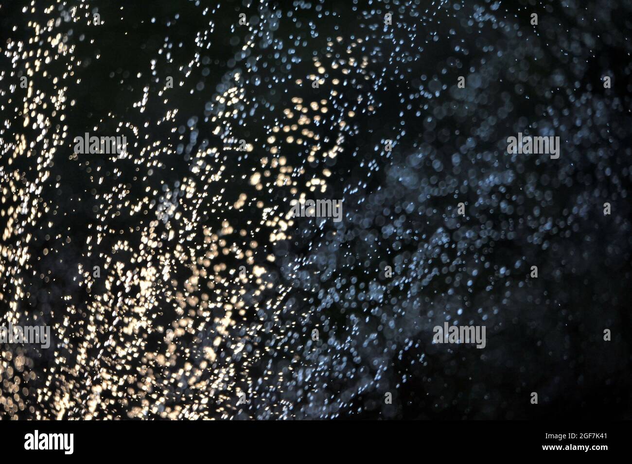 Water drops flying in one direction, waterdrops levitating on blur ...