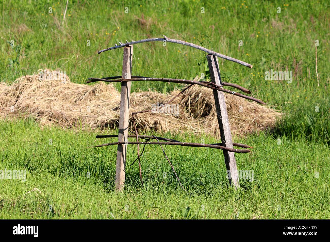 Old wooden support frame made of dry wooden boards and sticks used as ...
