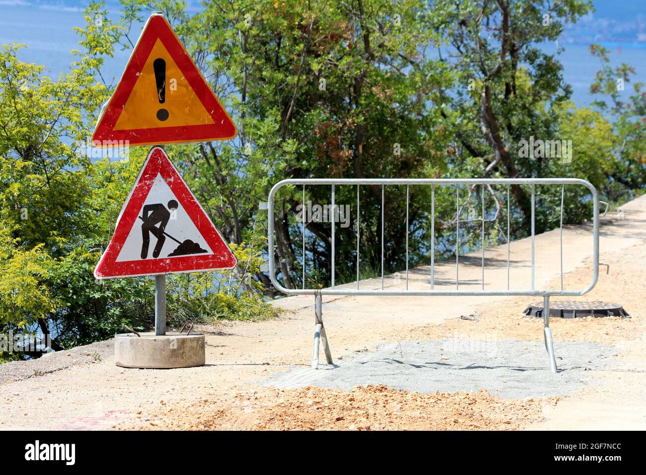 Start of closed road construction site with two heavily used ...