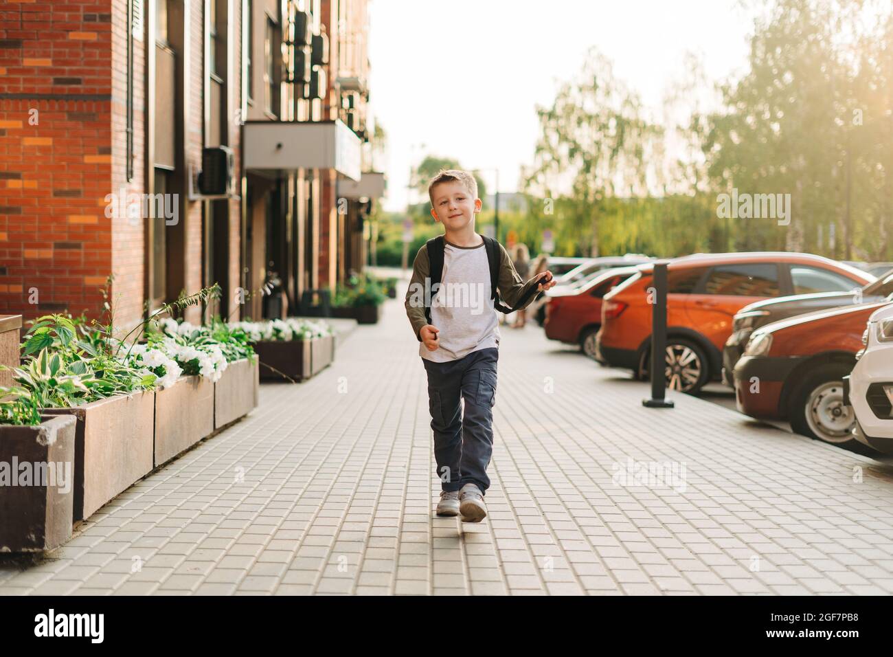 Back to school. Cute child with backpack running and going study to ...