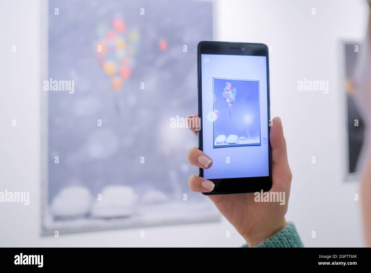 Woman using smartphone with AR application - contemporary art concept ...