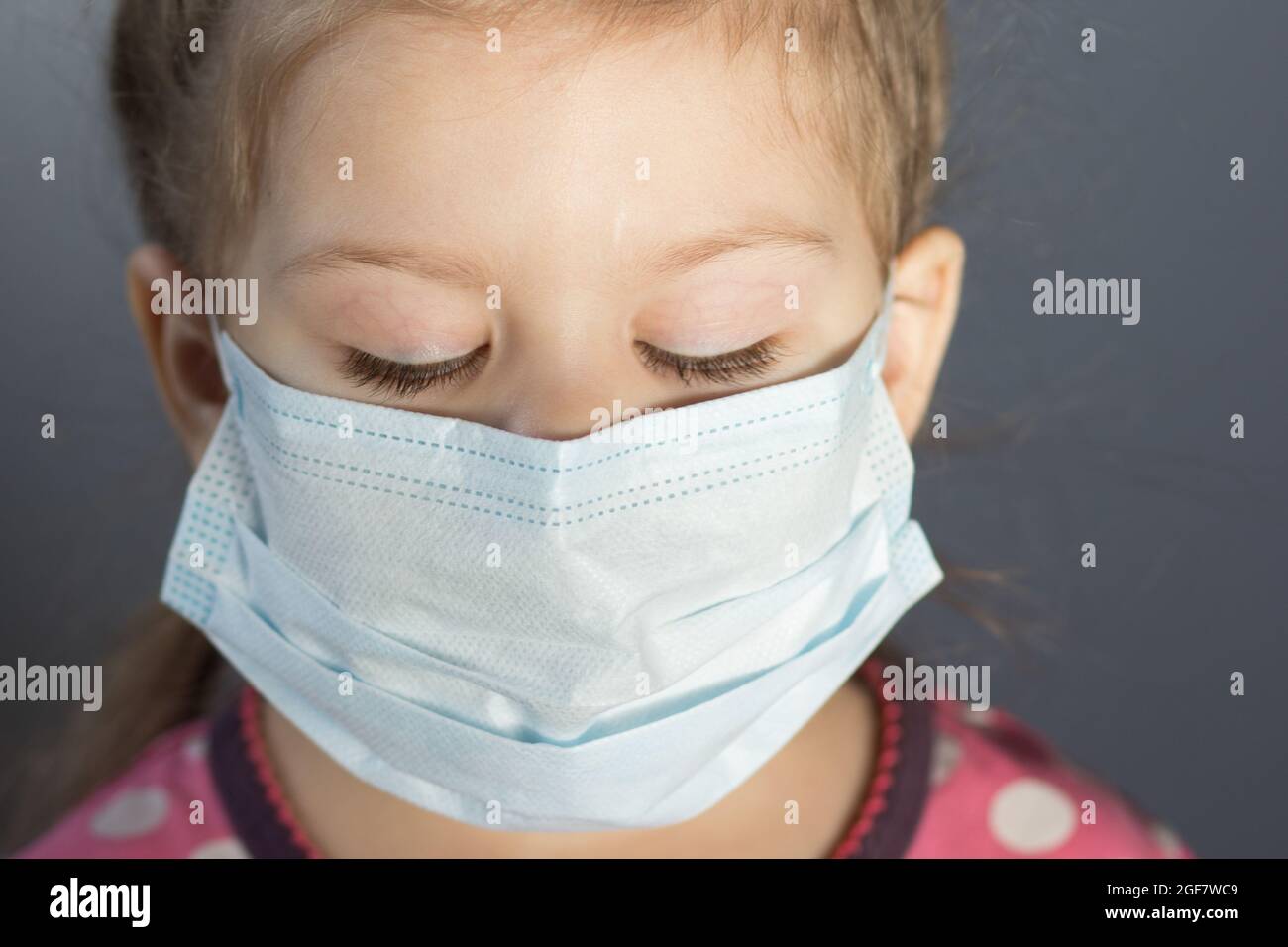 Portrait of caucasian child of three years old with mask on face ...