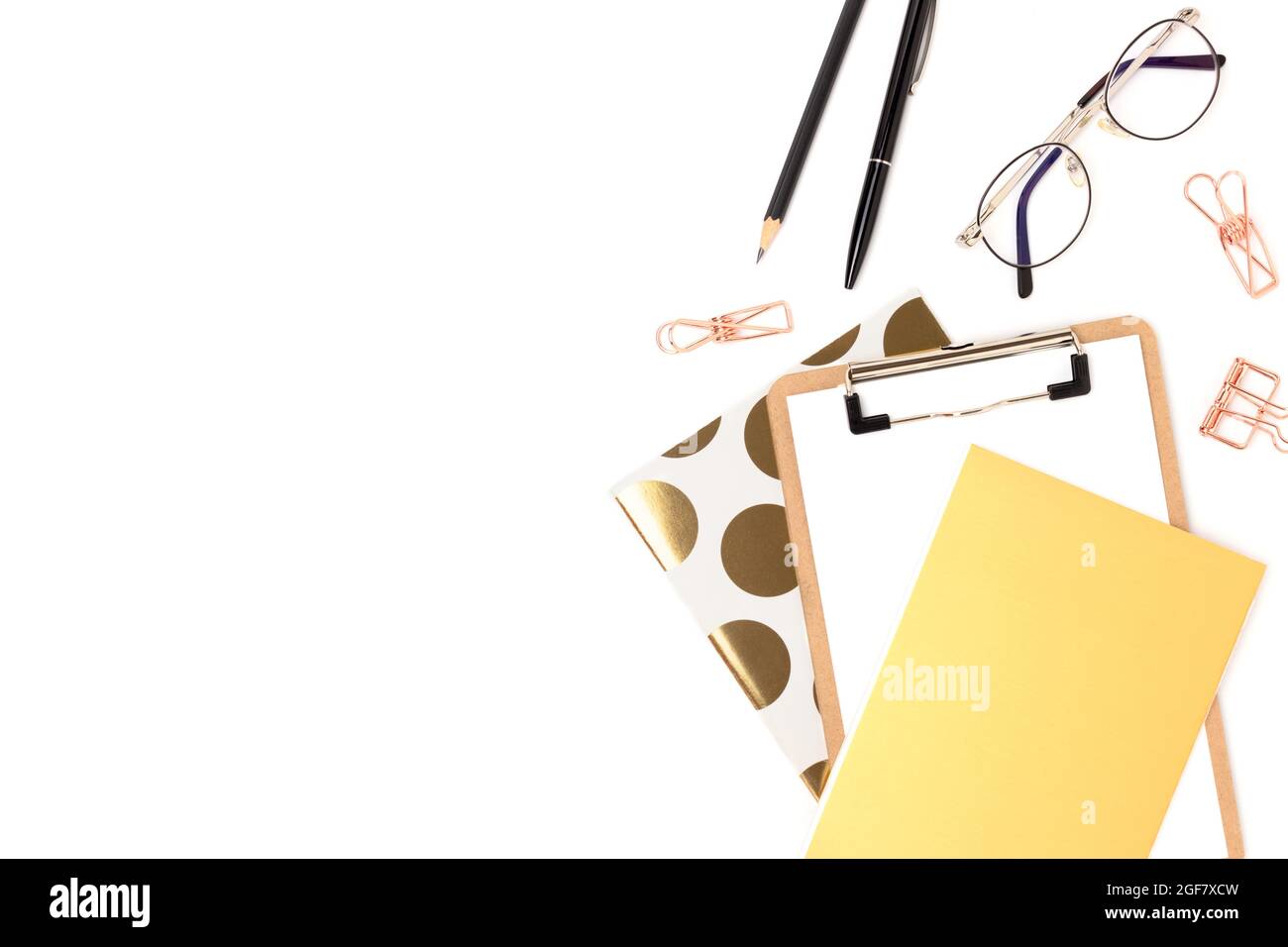 Gold colored school stationery on a white background. Education concept ...