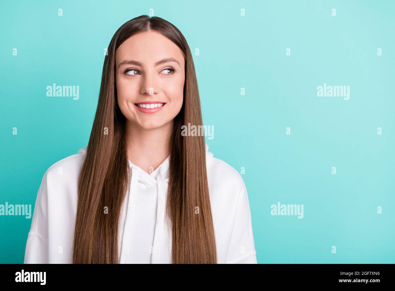 Photo of happy dreamy young positive woman look empty space smile ...