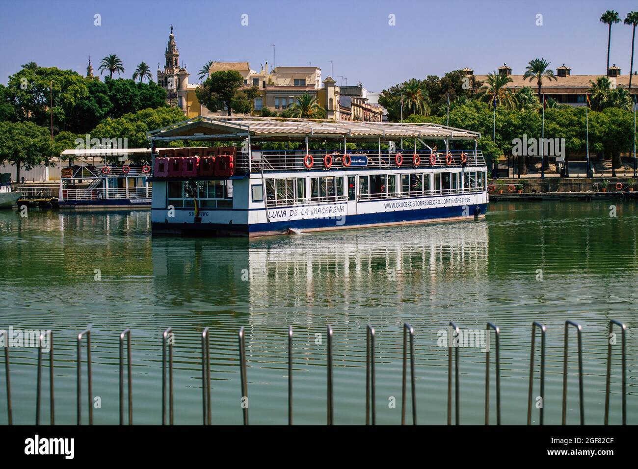 Seville Spain August 21, 2021 Tourist boats on the Guadalquivir River ...