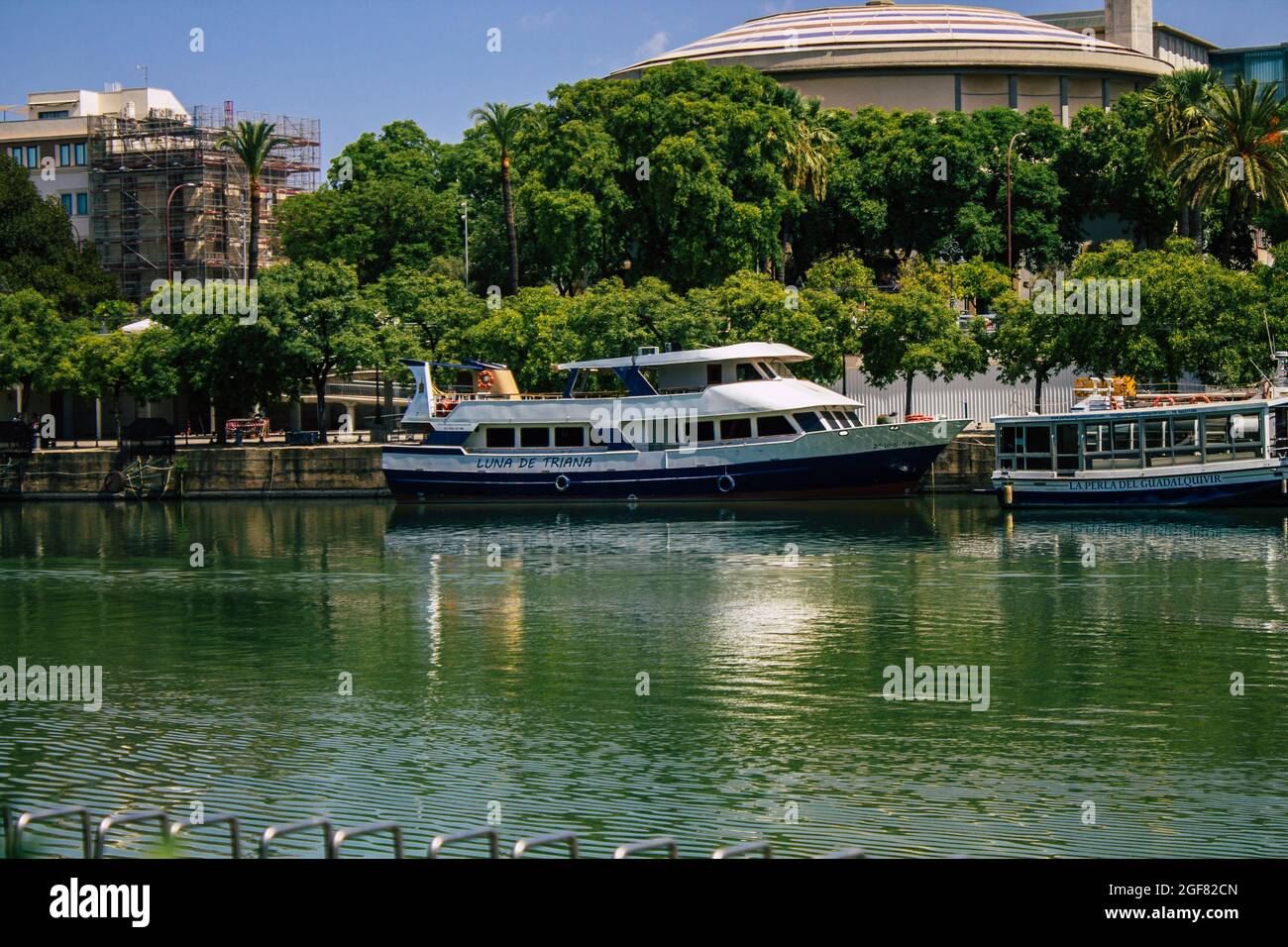 Seville Spain August 21, 2021 Tourist boats on the Guadalquivir River ...